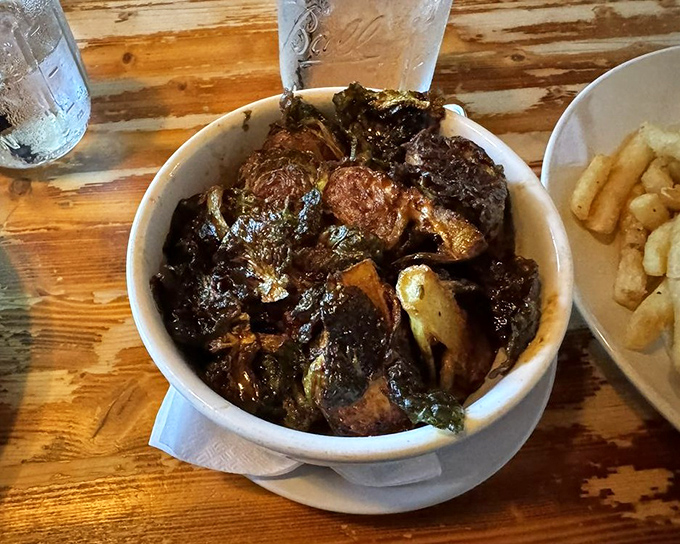 These aren't the Brussels sprouts of your childhood nightmares. Dark, caramelized, and mysterious&mdash;they've clearly lived an interesting life before reaching your table.