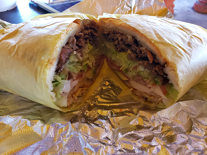 This massive burrito could feed a small army, packed with fresh ingredients and wrapped tight like a delicious Mexican present. 