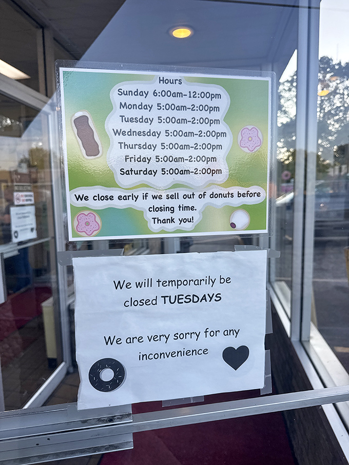 The hours sign that doubles as a warning: "We close when we sell out" translates to "Snooze and lose" in donut enthusiast language.