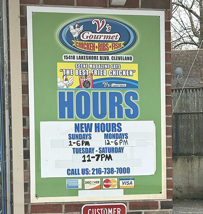 Business hours posted clearly &ndash; crucial information for planning your chicken fix. Some might call this the most important signage in Cleveland.