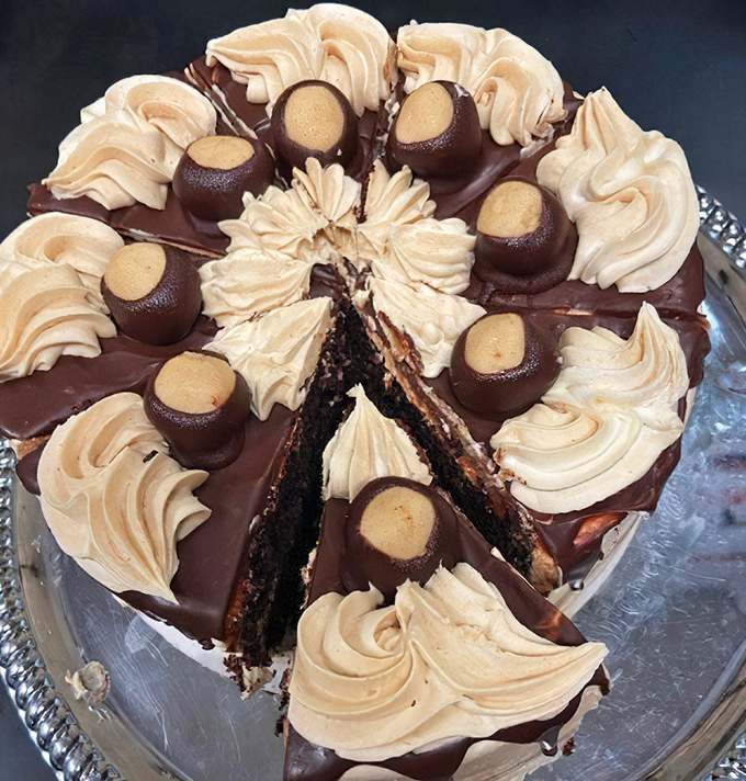 This isn't just dessert&mdash;it's performance art. A chocolate masterpiece topped with buttercream swirls and candy that demands appreciation.