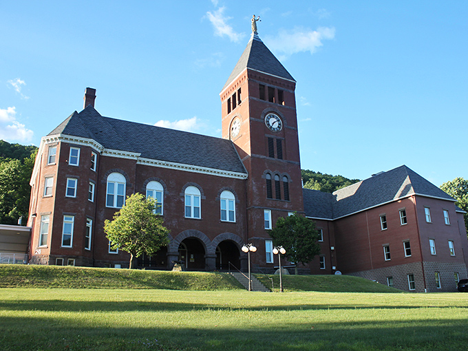 The Cameron County Courthouse stands as a red-brick testament to small-town governance, where decisions are made by people you're likely to see at the grocery store.