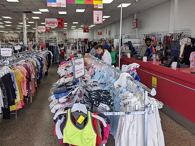 The checkout area buzzes with activity as shoppers prepare to give new homes to their carefully curated second-hand finds.