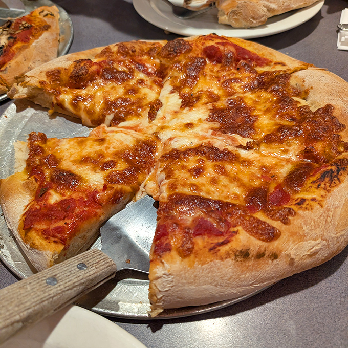 The cheese pizza in its purest form&mdash;a canvas of molten perfection. Sometimes the simplest things truly are the most extraordinary.