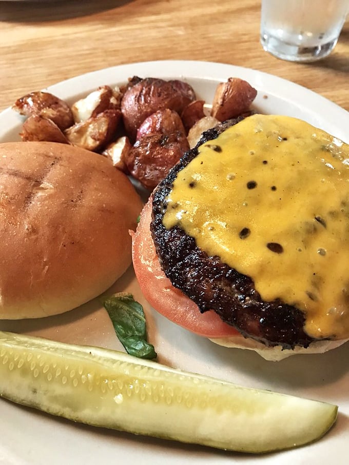 Burger theology 101: Perfect char, melty cheese, and those home fries on the side? I'd write a sermon about this if my mouth wasn't full.