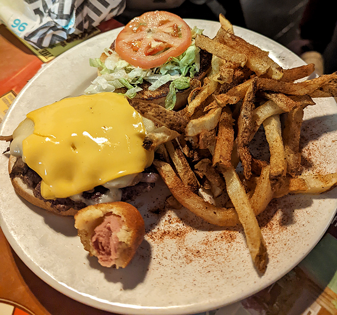 A burger that requires both hands and several napkins &ndash; melted cheese cascading down the sides like a yellow waterfall of deliciousness.