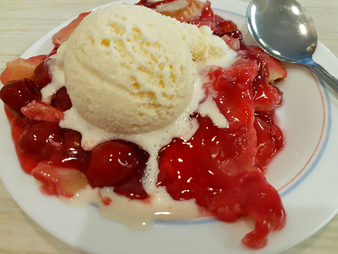 Cherry pie that makes you understand why people write songs about dessert. That melting ice cream is creating a sweet symphony on the plate.
