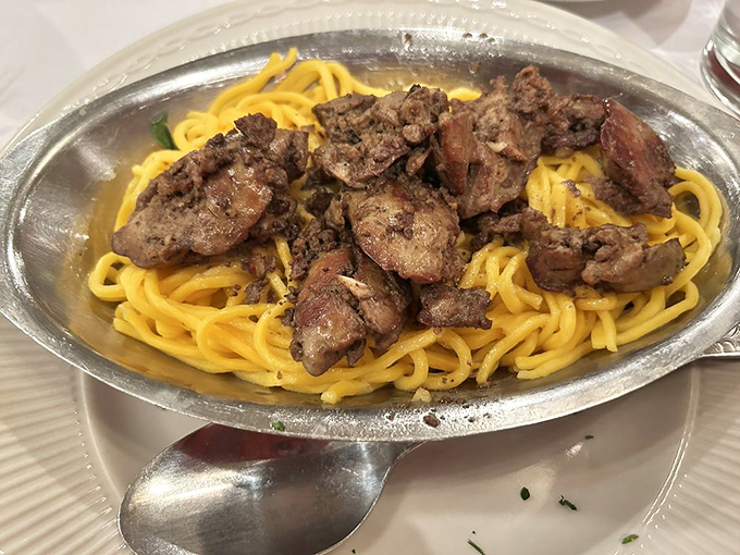 Chicken livers over pasta—a throwback dish that reminds us some culinary traditions deserve to be preserved rather than "reimagined."