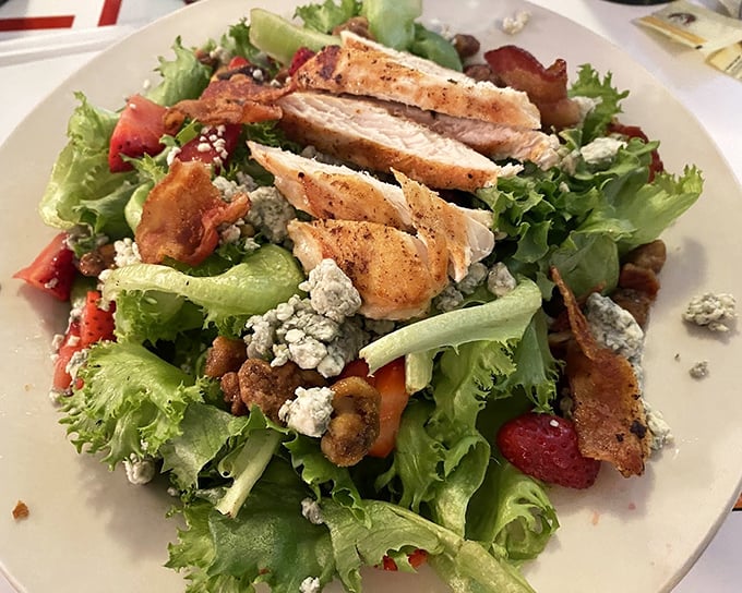 This chicken salad doesn't just check the "healthy option" box &ndash; it celebrates it with vibrant greens, blue cheese crumbles, and protein that wasn't sacrificed for virtue.