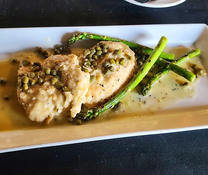 Chicken piccata with capers scattered like confetti, celebrating the marriage of lemon brightness and buttery richness that makes taste buds dance.