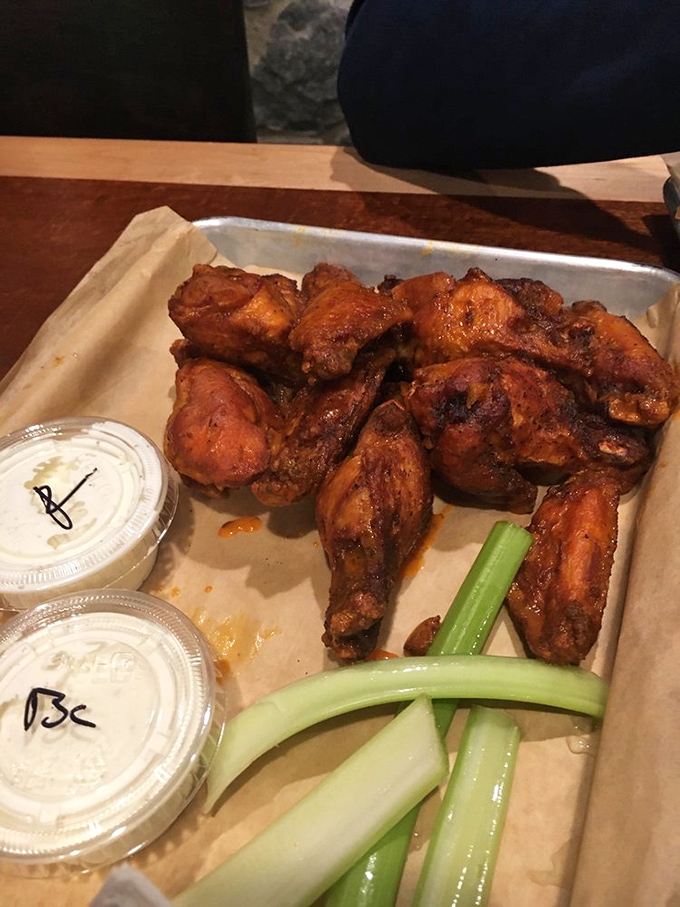 Wings so perfectly glazed they look like they've been taking tanning tips from George Hamilton, with dipping sauces standing by for backup.