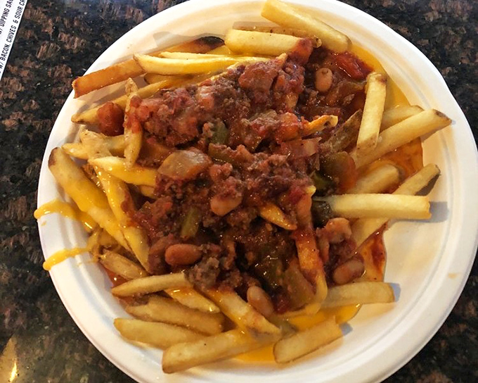 Fries transformed into a complete meal. Golden potatoes swimming in chili and cheese&mdash;a delicious reminder that sometimes more is more.