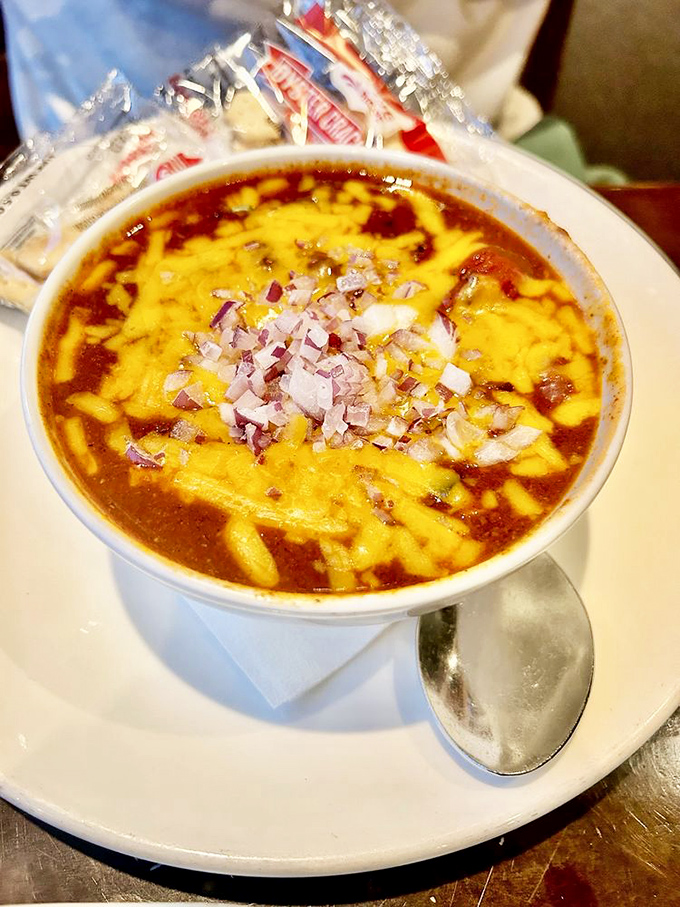 This isn't just chili &ndash; it's a bowl of Midwest comfort topped with melted cheese and diced onions that warm you from the inside out.