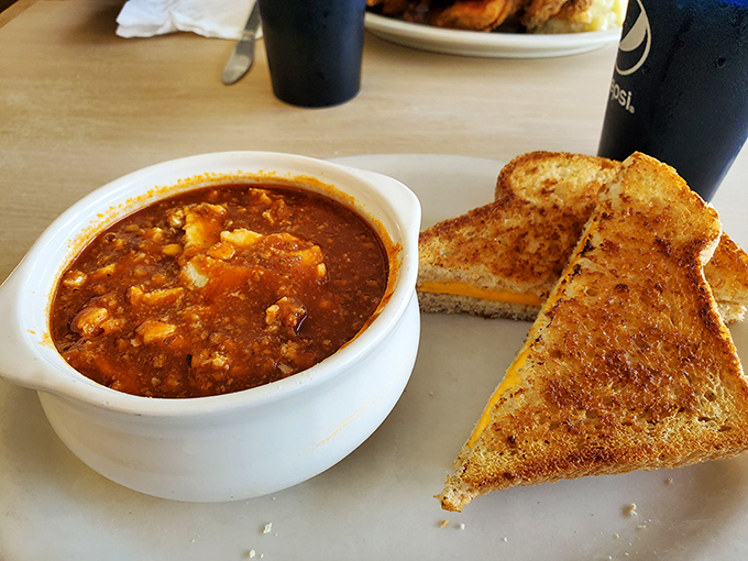 A bowl of hearty chili with grilled cheese for dipping—the lunch combo that makes winter almost worth it.