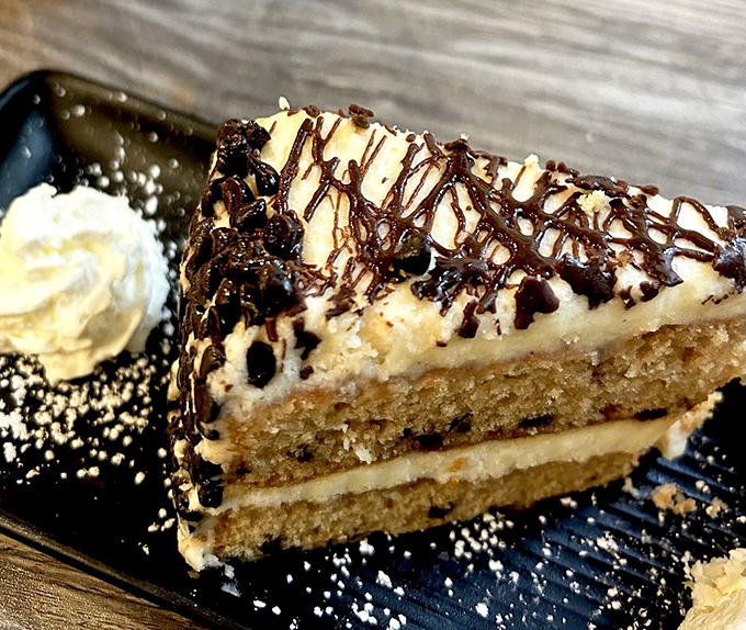 A cake that doesn't just satisfy your sweet tooth&mdash;it negotiates a peace treaty with it. That whipped cream isn't garnish&mdash;it's the perfect cool counterpoint.