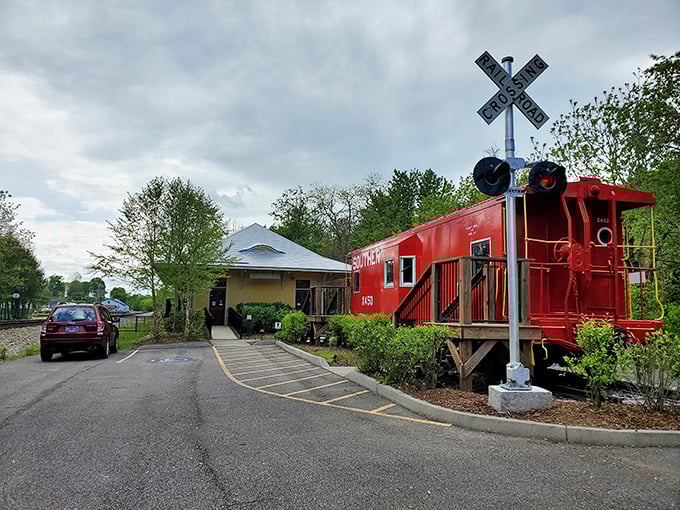 This cheerful red caboose serves as both landmark and museum. Railroad history that doesn't require an engineering degree to appreciate.