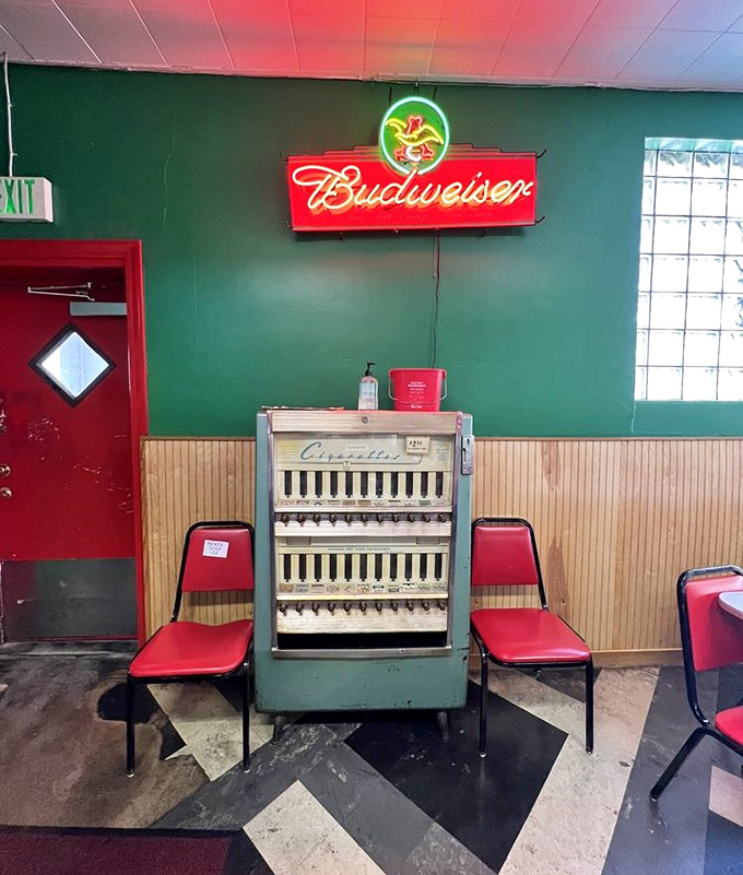 An antique cigarette machine stands as a relic of bygone days. Now more museum piece than vending machine, it's a conversation starter for younger visitors.