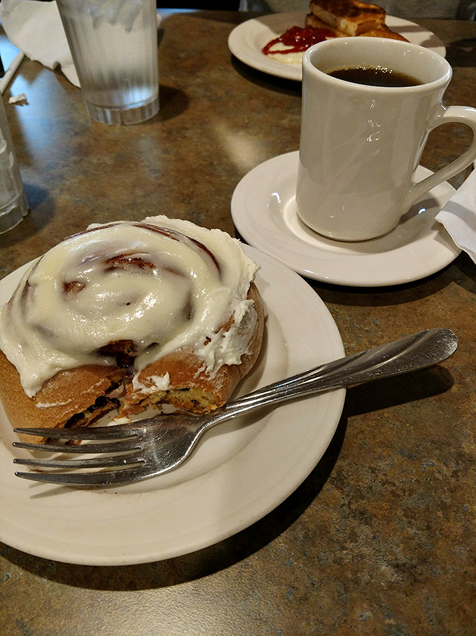 A cinnamon roll frosted so generously it could qualify as a winter sport in Ohio. Pairs perfectly with that second cup of coffee and zero regrets.