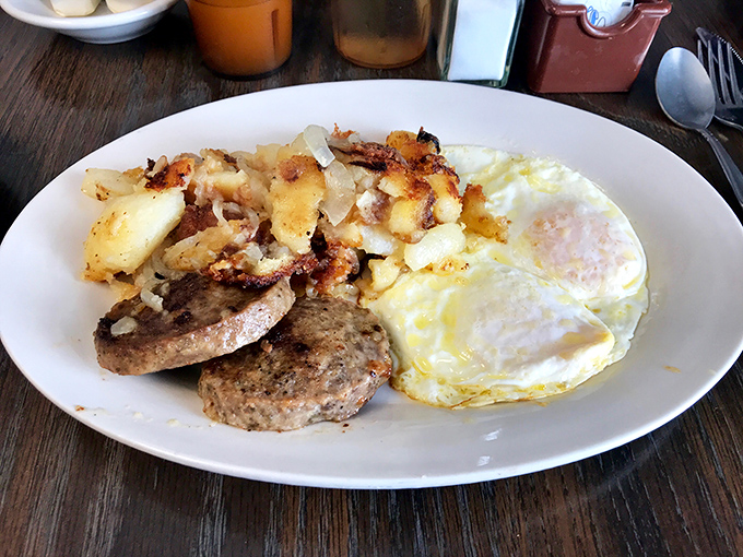 The breakfast plate that launched a thousand satisfied sighs&mdash;eggs, potatoes, and sausage in perfect harmony like a culinary power trio.