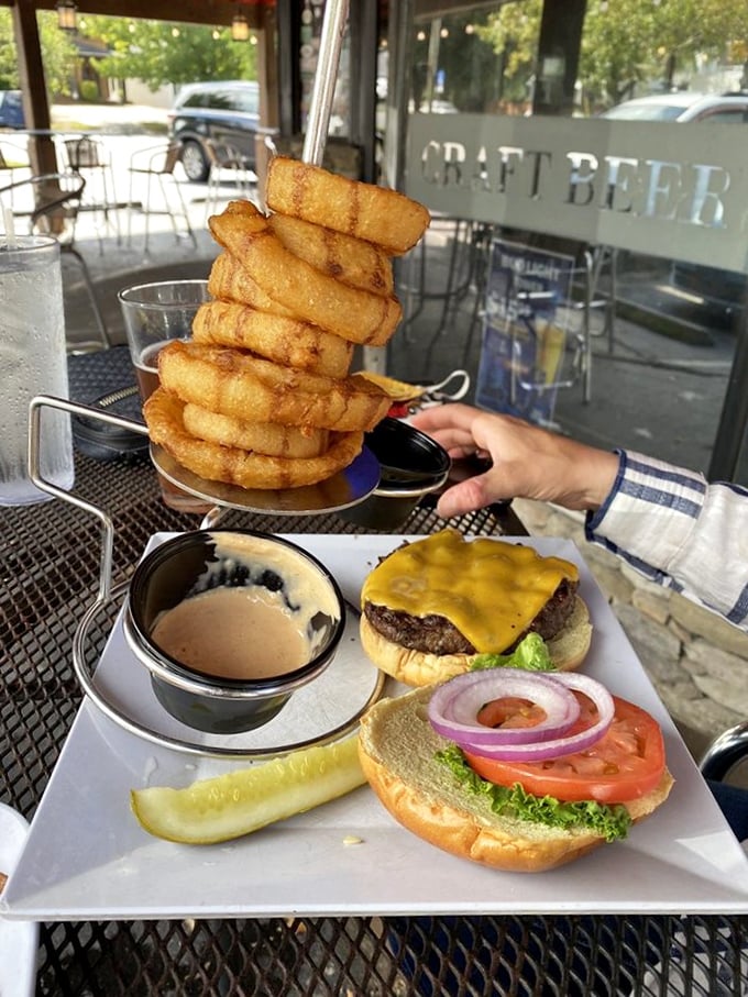 The tower of onion rings threatens to steal the spotlight from the cheeseburger below&mdash;a delicious standoff where everyone wins, especially your taste buds.