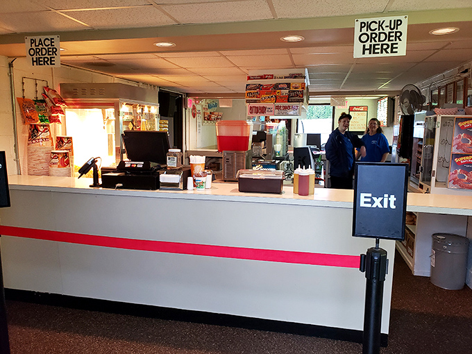 Inside the concession stand, the promise of buttery popcorn and candy creates the essential soundtrack to intermission.