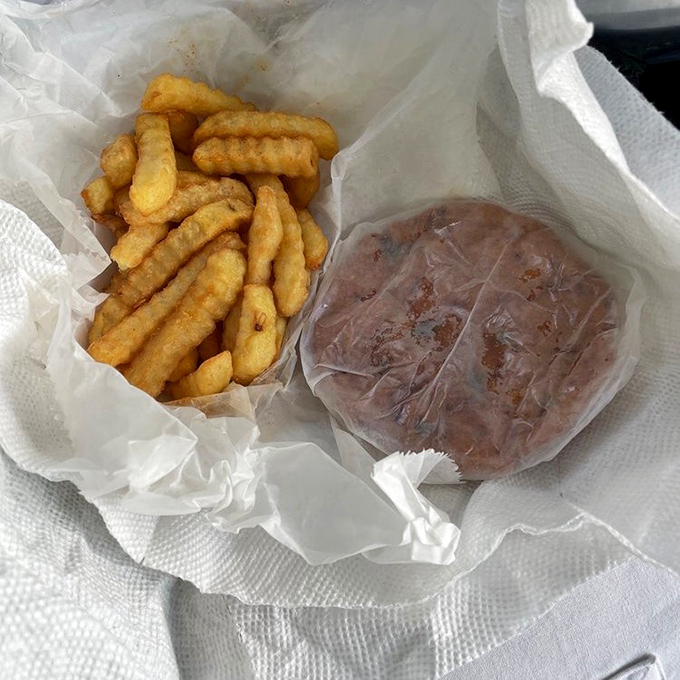 The dynamic duo strikes again: conch fritters and fries, together at last in fried food harmony.