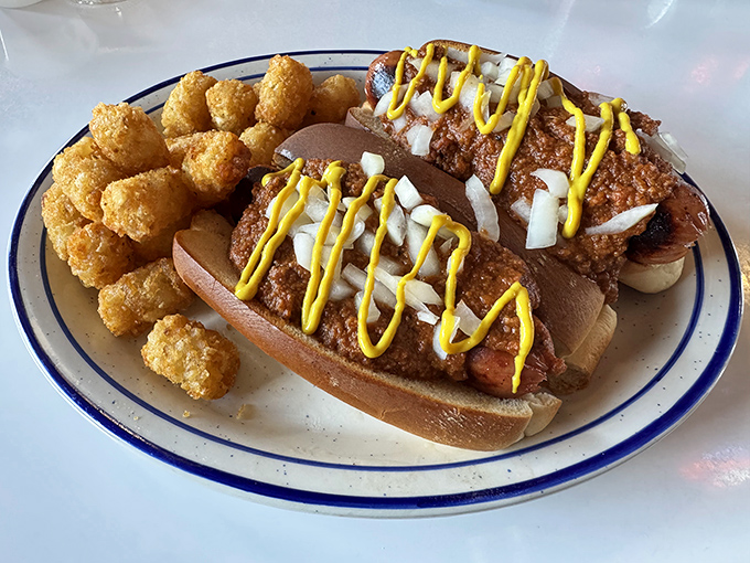 This isn't just a hot dog &ndash; it's a Coney with attitude, dressed to impress and chaperoned by golden tater tots.