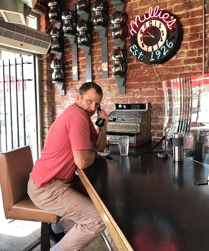 Counter culture at its finest—where solo diners find community and vintage charm. That neon clock reminds you it's always time for breakfast.
