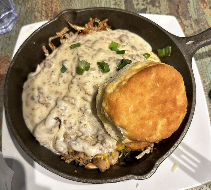 This country-style skillet and golden biscuit combo isn't just breakfast&mdash;it's a Southern hug on a plate, complete with green onion confetti.