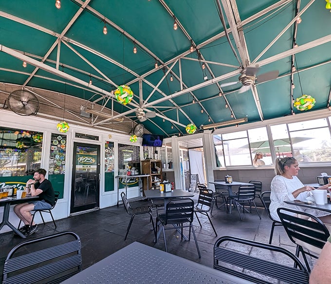 The covered patio offers al fresco dining with a turquoise ceiling. Where burger enthusiasts can enjoy Raleigh's weather while avoiding its occasional whims.