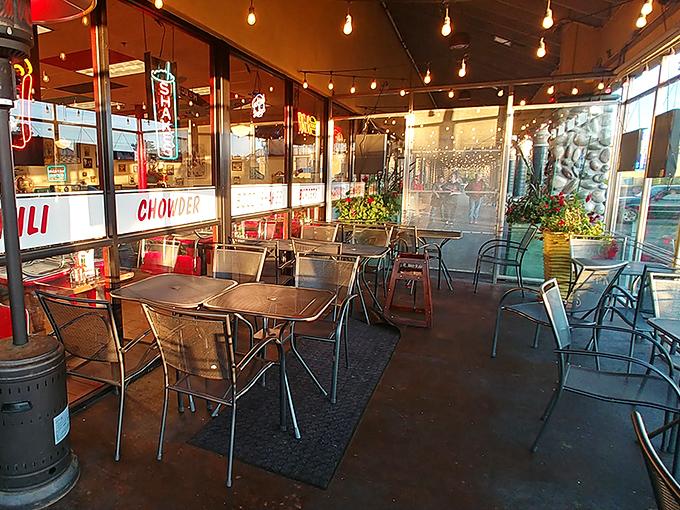 The covered patio where string lights twinkle above, perfect for those "too nice to be inside" Oregon days that locals cherish.