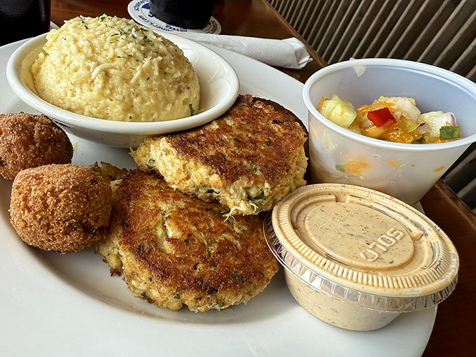 Crab cakes and hushpuppies &ndash; the dynamic duo of coastal comfort food &ndash; arrive golden-brown and ready to transport you to seafood nirvana. 