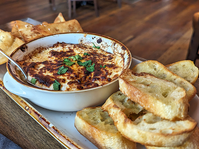 Bubbling cheese dip with golden toasted bread for dipping&mdash;a combination that has launched countless diet resets. "I'll start tomorrow" was never more justified.