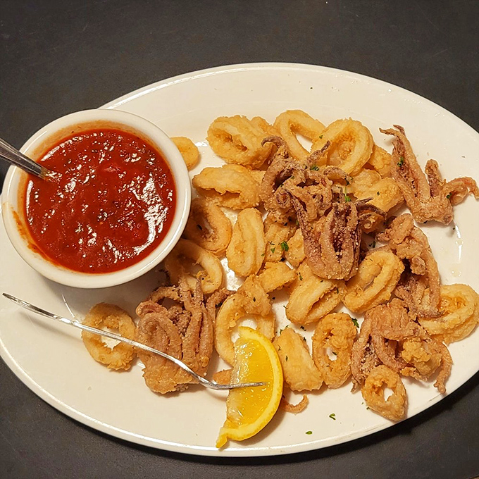 Crispy calamari that shatters with each bite, served with marinara so good you'll be dipping your fingers when no one's looking.