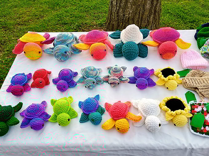 Crocheted turtles swimming across a sea of white fabric. Handmade with love and priced less than your morning latte habit.