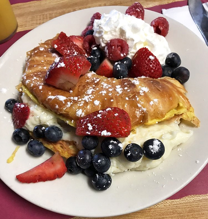A breakfast that's having more fun than most people's desserts. This croissant French toast with berries is what happens when breakfast gets dressed for a party.