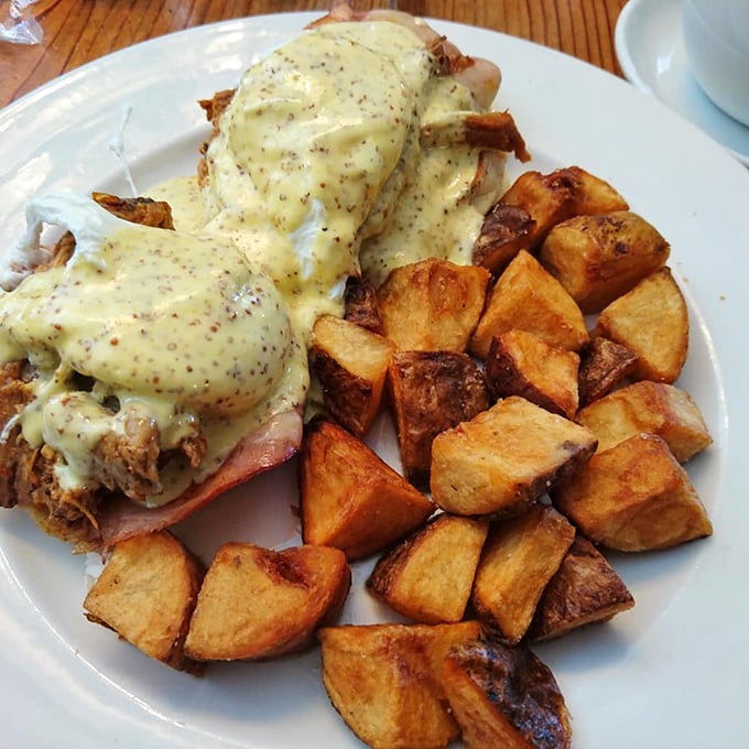 Hollandaise sauce cascading over perfectly poached eggs &ndash; this Benedict doesn't just satisfy hunger, it creates happiness on a plate.