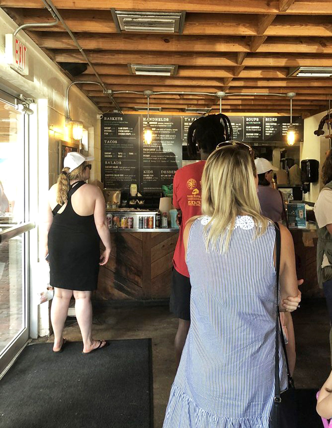 The ordering line at Timoti's &ndash; where strangers become comrades united by the common purpose of securing exceptional seafood. The anticipation is palpable.