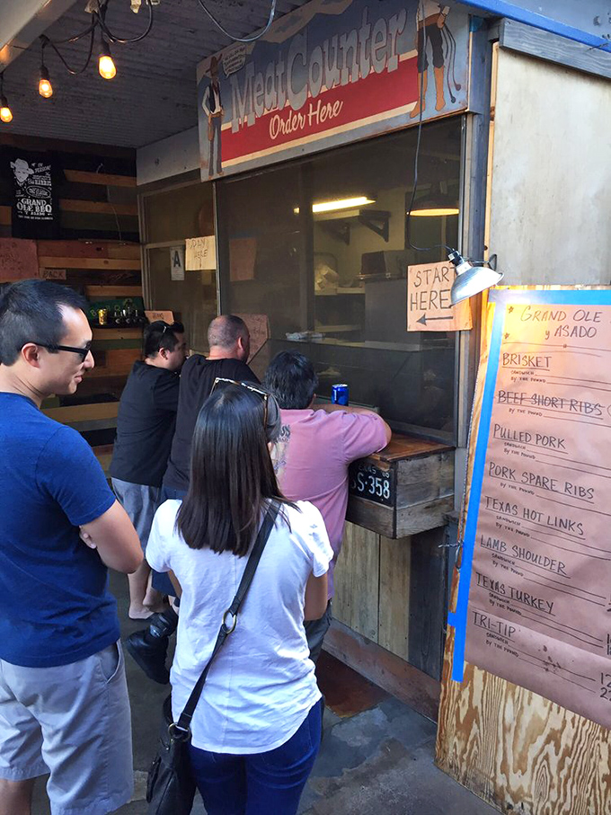 The line forms early at the meat counter, where barbecue democracy is in full effect. Everyone waits their turn for a taste of smoky nirvana.