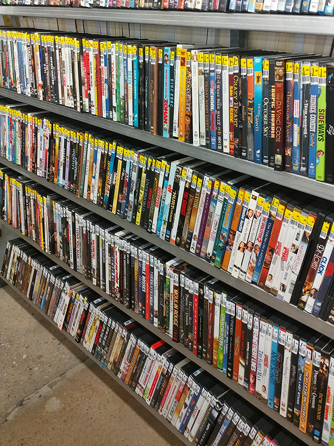 The DVD section: a physical Netflix from the before-times, where Adam Sandler's entire filmography awaits for pocket change.