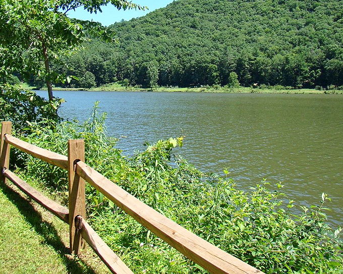 The reservoir's calm waters mirror perfect hillsides, creating a double dose of scenery that's twice as nice as you expected.