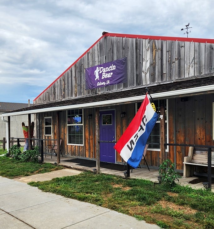 The Dancin' Bear's rustic wooden exterior and purple door promise homestyle comfort and local flavor&mdash;the kind of place where regulars have "the usual."