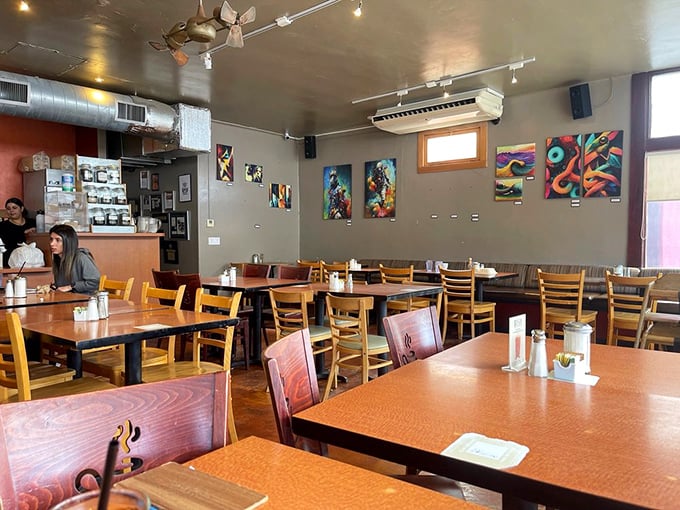 Local art adorns walls while wooden chairs invite lingering conversations&mdash;the perfect backdrop for morning revelations over coffee refills.