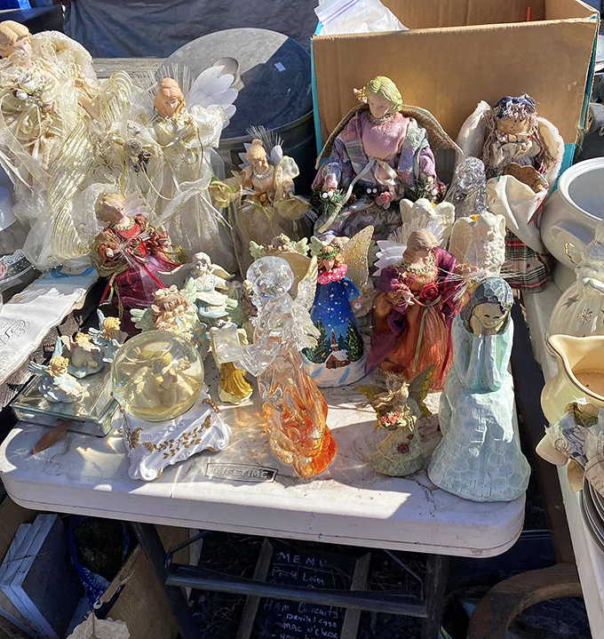 Angel figurines and decorative glass create a miniature fantasy world &ndash; one person's kitsch is another's cherished mantelpiece treasure.