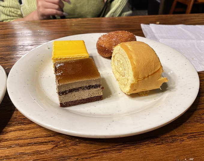 The dessert trifecta: cake, roll, and donut. Because after three plates of savory indulgence, your sweet tooth deserves equal attention.
