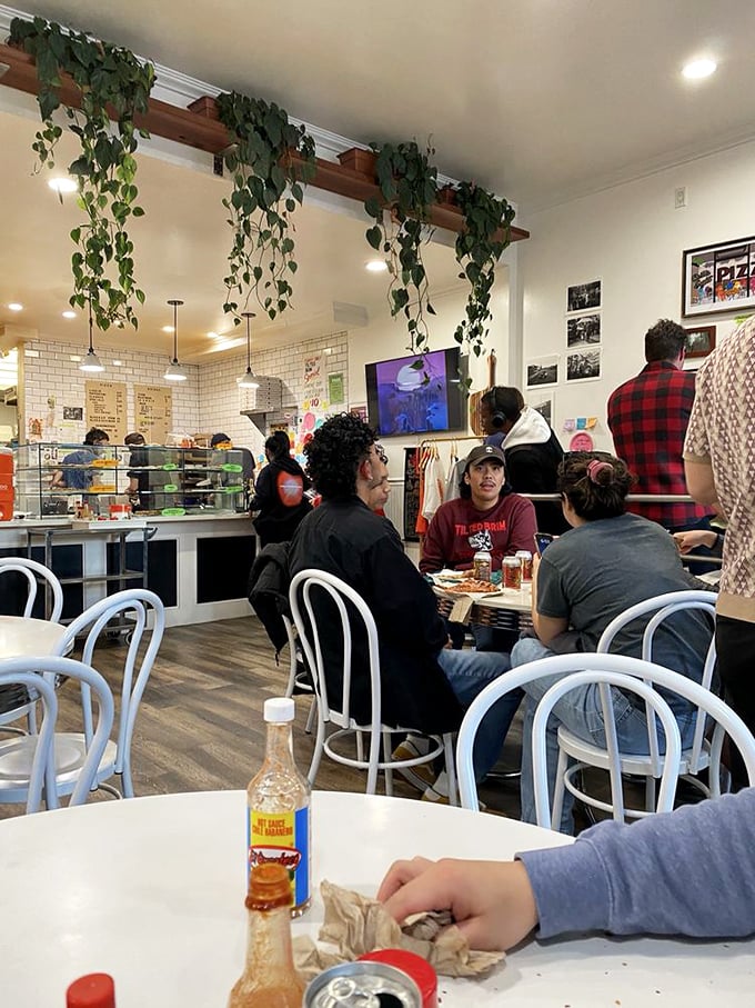 Community happens naturally around good food. These tables have witnessed first dates, celebrations, and the universal nod of pizza appreciation.