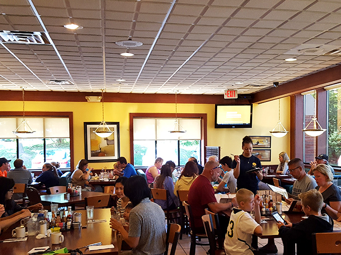A bustling dining room filled with the breakfast faithful&mdash;proof that in Ann Arbor, pancake worship is a community affair.