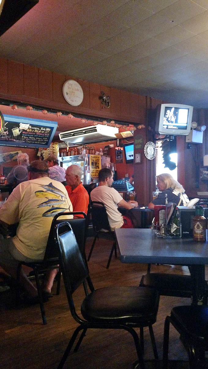 Regulars belly up to the bar where conversations flow as freely as the drinks, creating that community vibe that's the hallmark of any great roadhouse.