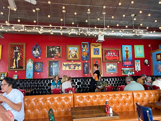 Happy diners surrounded by colorful art &ndash; this is what a true neighborhood gathering place looks like. 