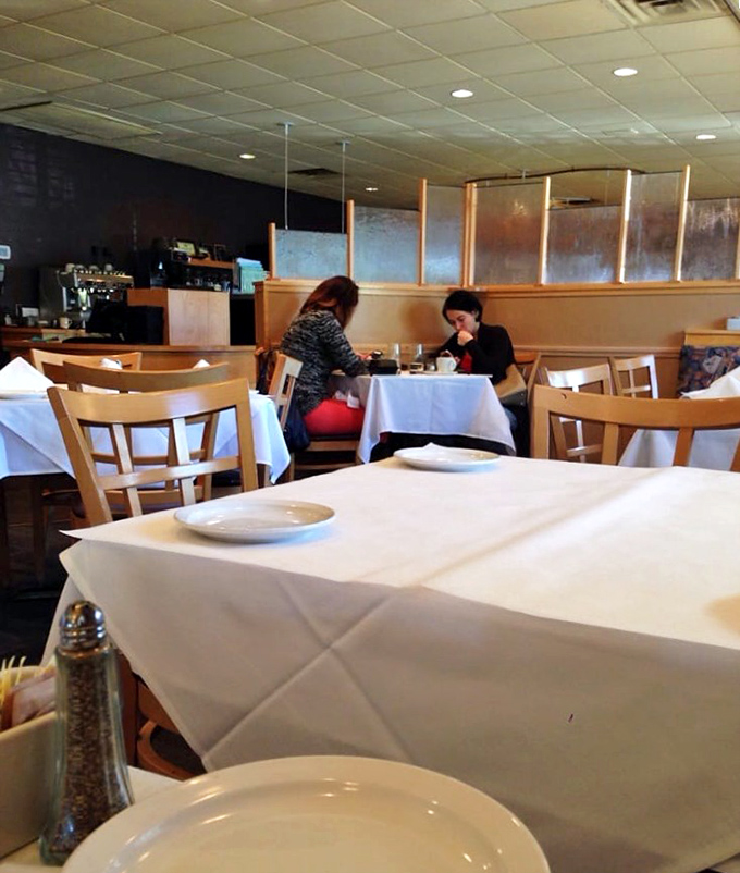 White tablecloths that signal "this meal matters" without the stuffiness that often accompanies fine dining experiences.